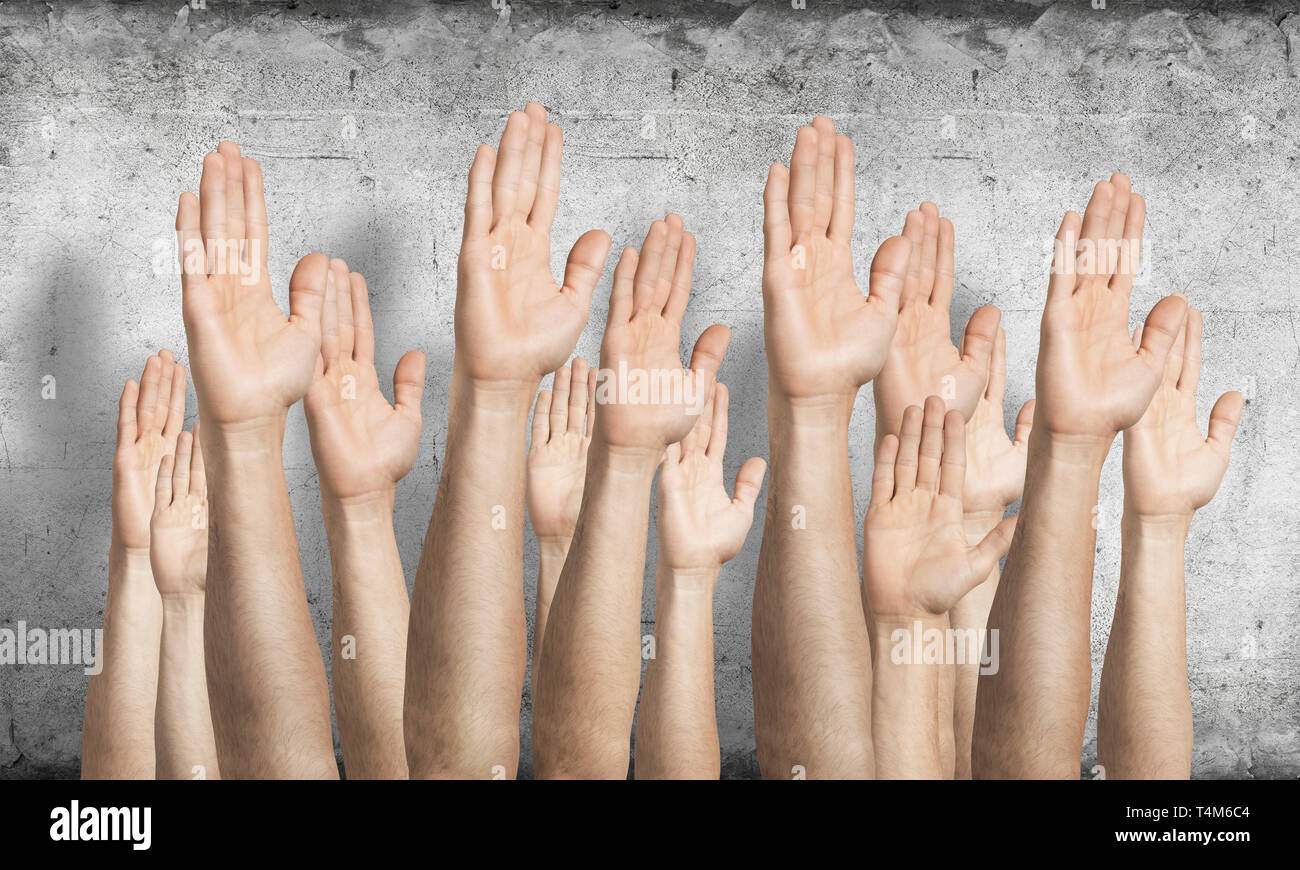 Row of man hands showing voting gesture Stock Photo - Alamy