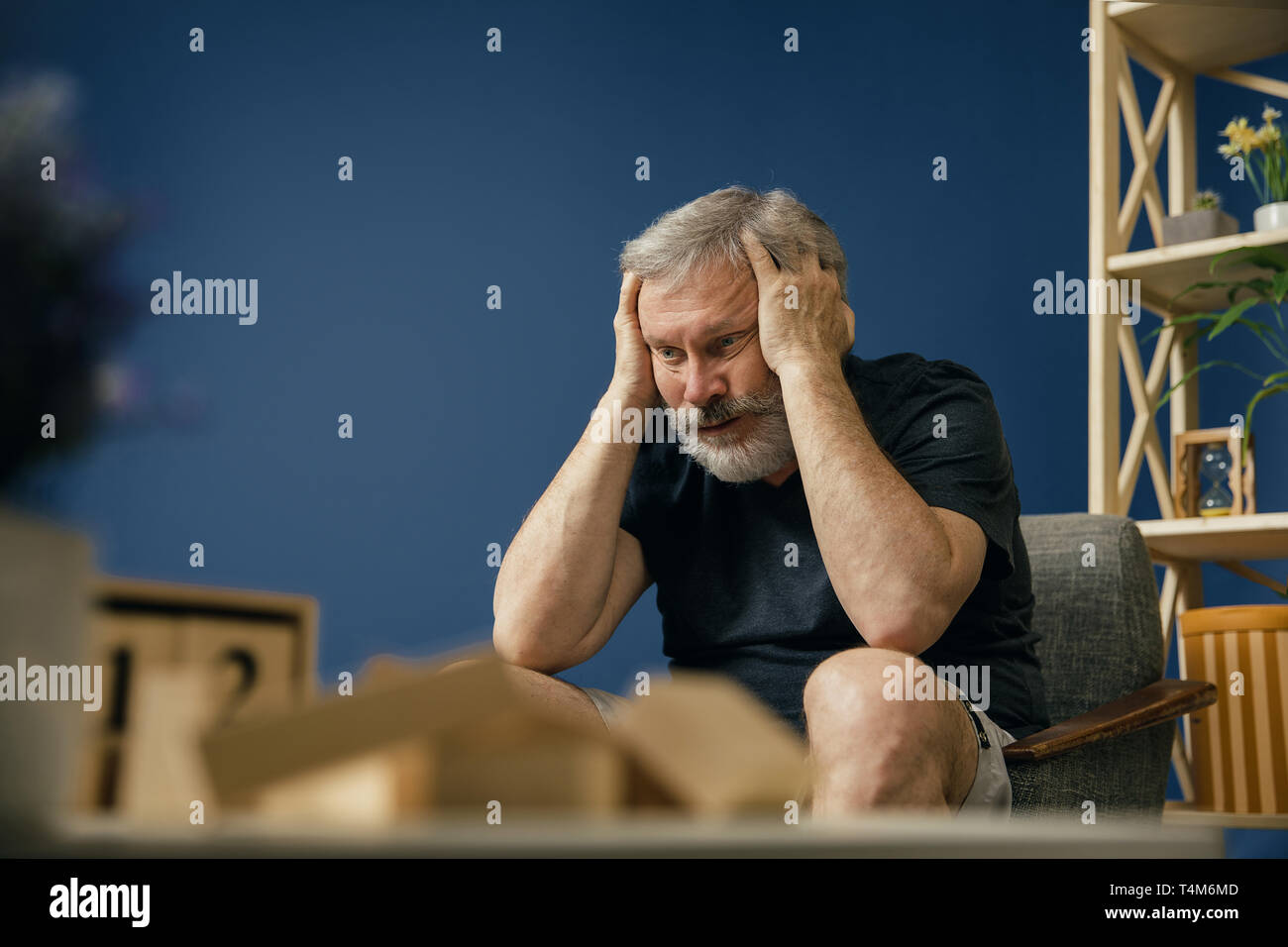 Loosing all the memories. Old bearded man with alzheimer desease ...