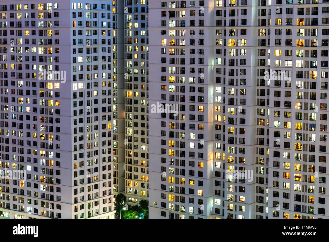 Exterior of apartment building at night with light from windows Stock ...