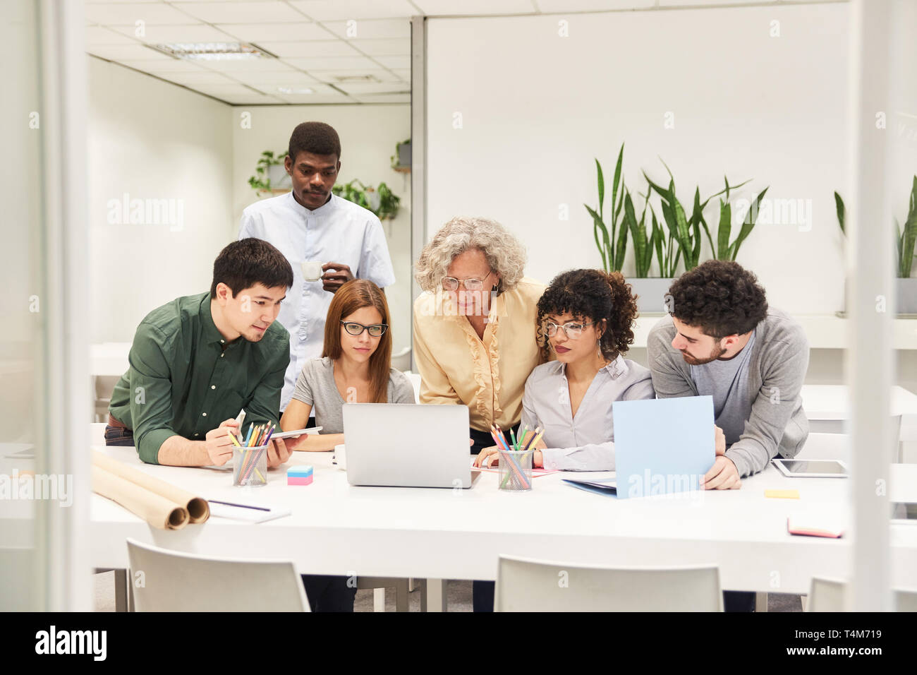 Developer team at strategy planning together at laptop computer in ...