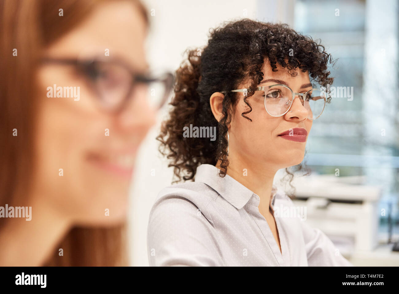 Portrait young woman colleagues hi-res stock photography and images - Alamy