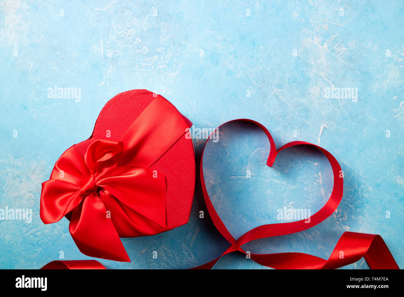 Valentines Day background with red heart and gift box. Heart shape from ...