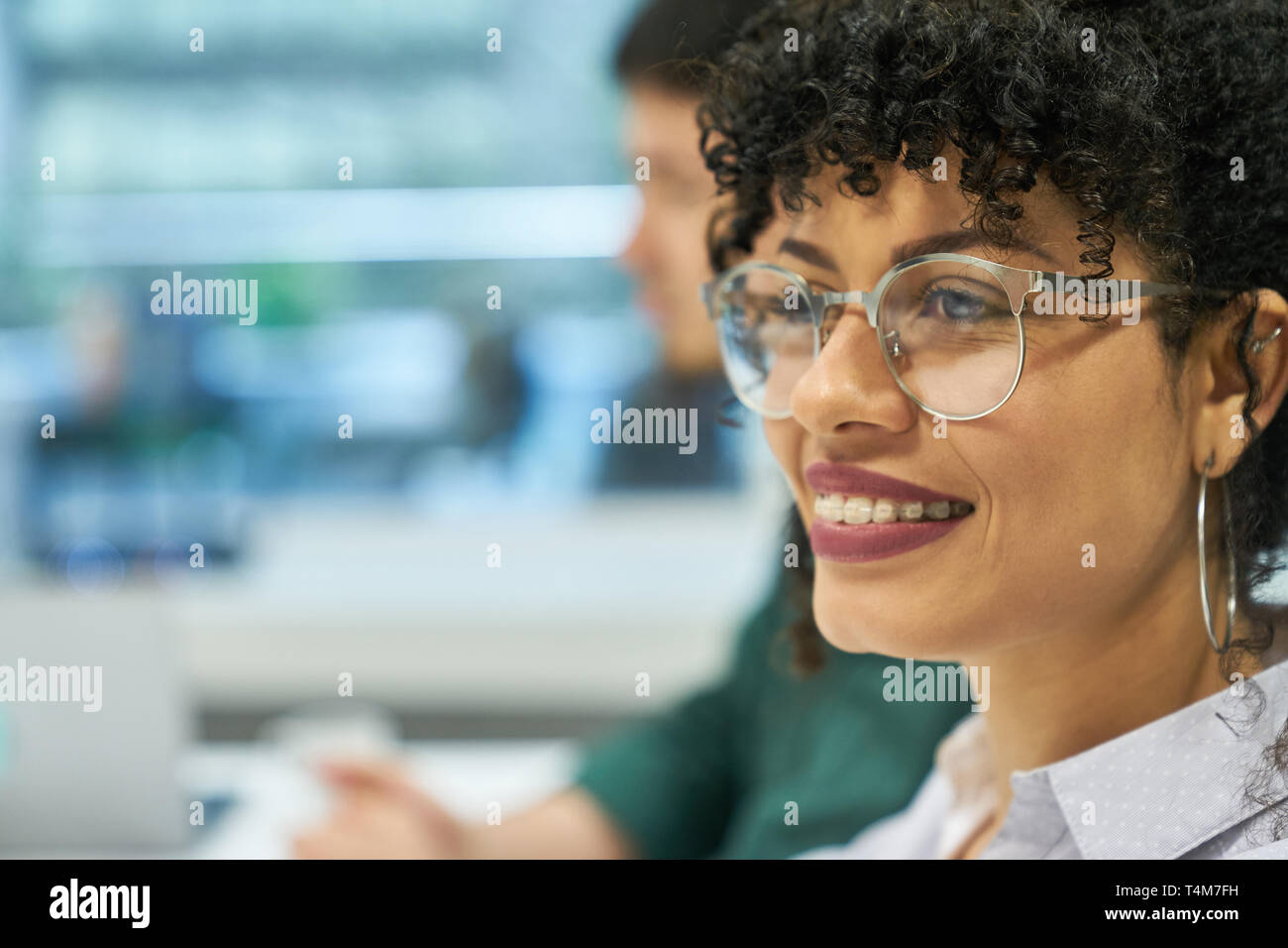 Young African woman as a business trainee or student in multicultural ...