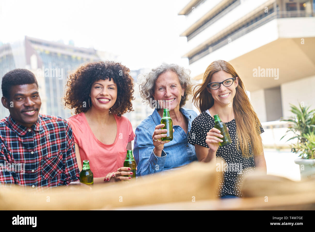 Drink after work happy colleagues hi-res stock photography and images ...