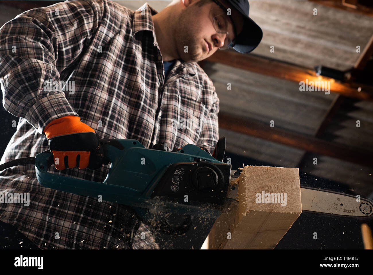 Man using miter saw to cut wood hi-res stock photography and images - Alamy
