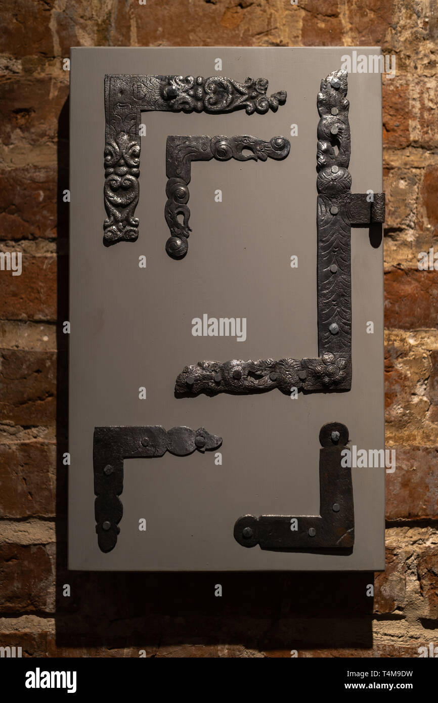 Old door holes and handles - Wooden entrance on brick walls - Handles ...