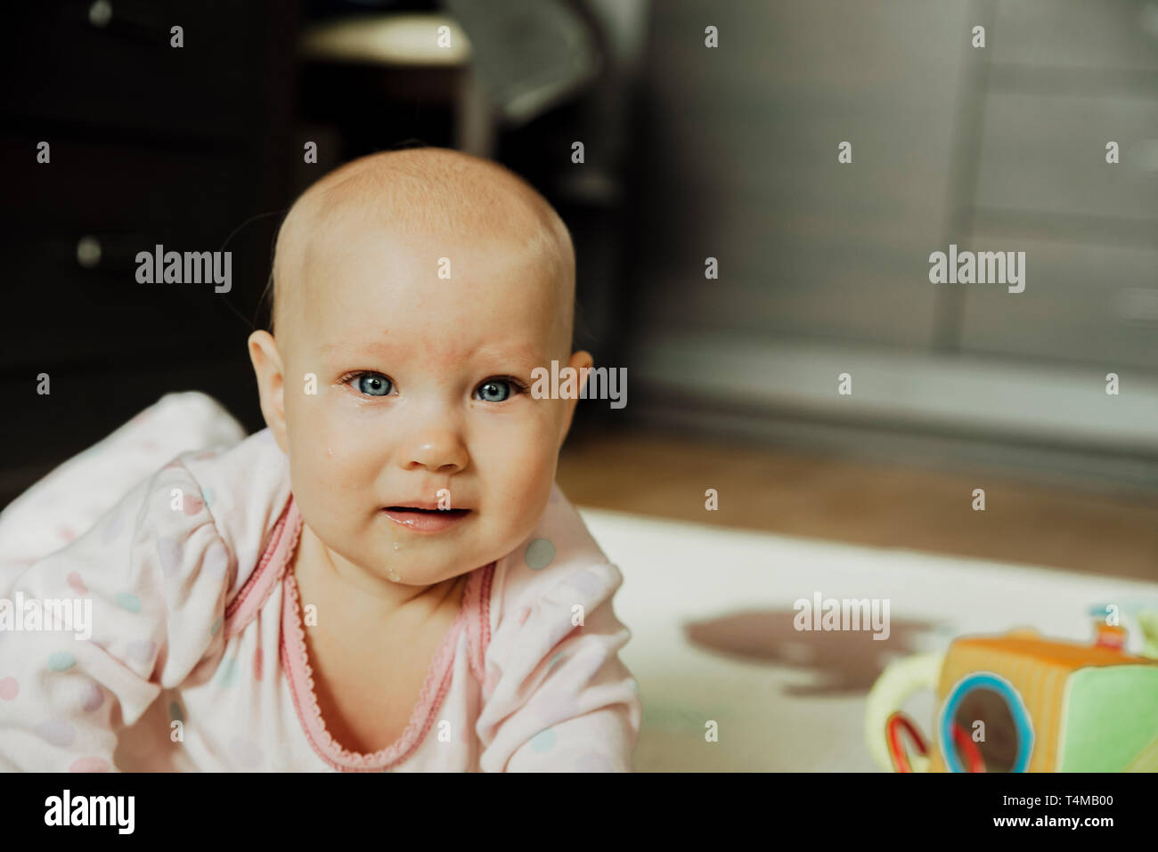 the first cold in a young child, crying, glass eyes, illness Stock ...