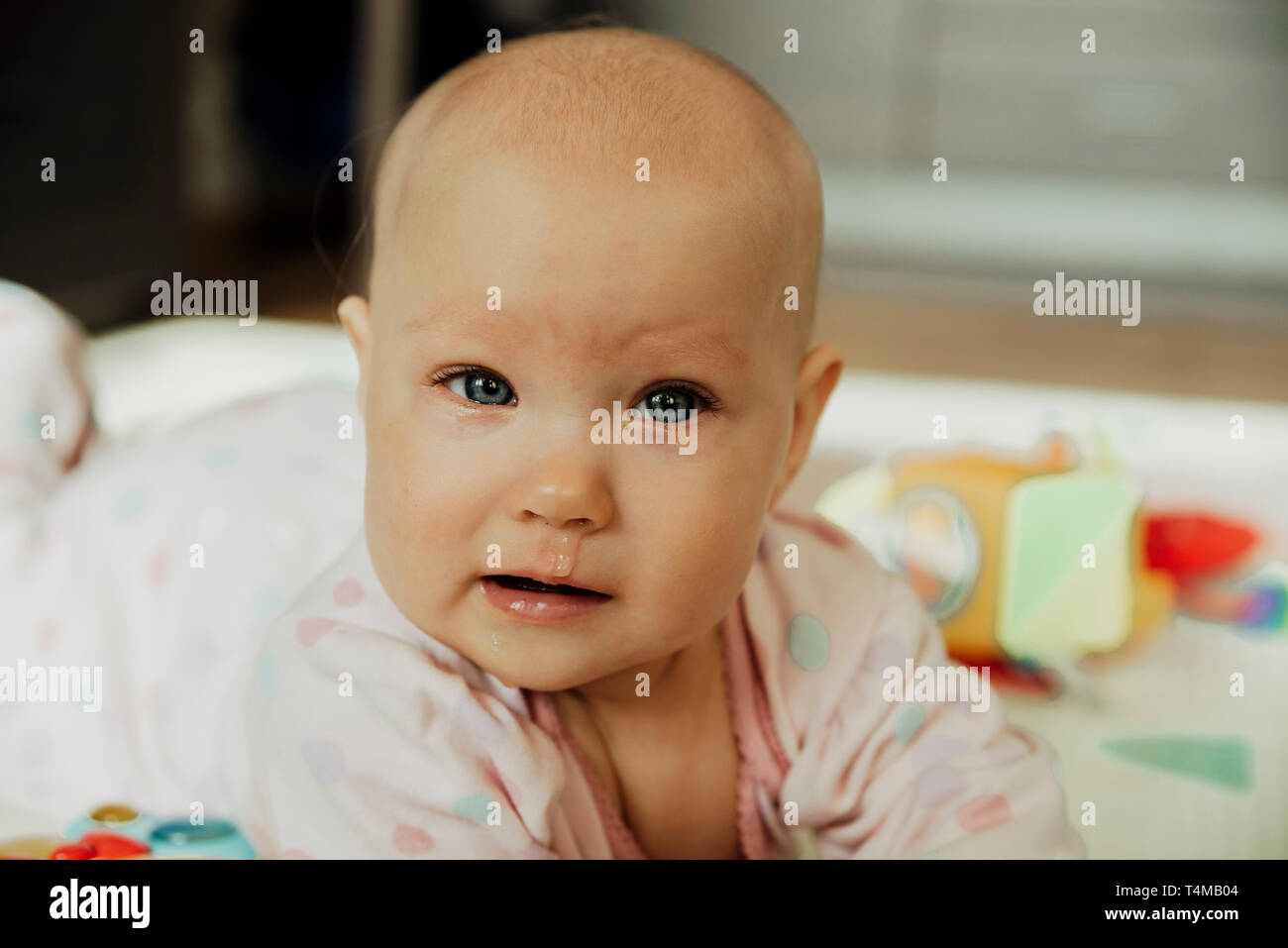 the first cold in a young child, crying, glass eyes, illness Stock ...
