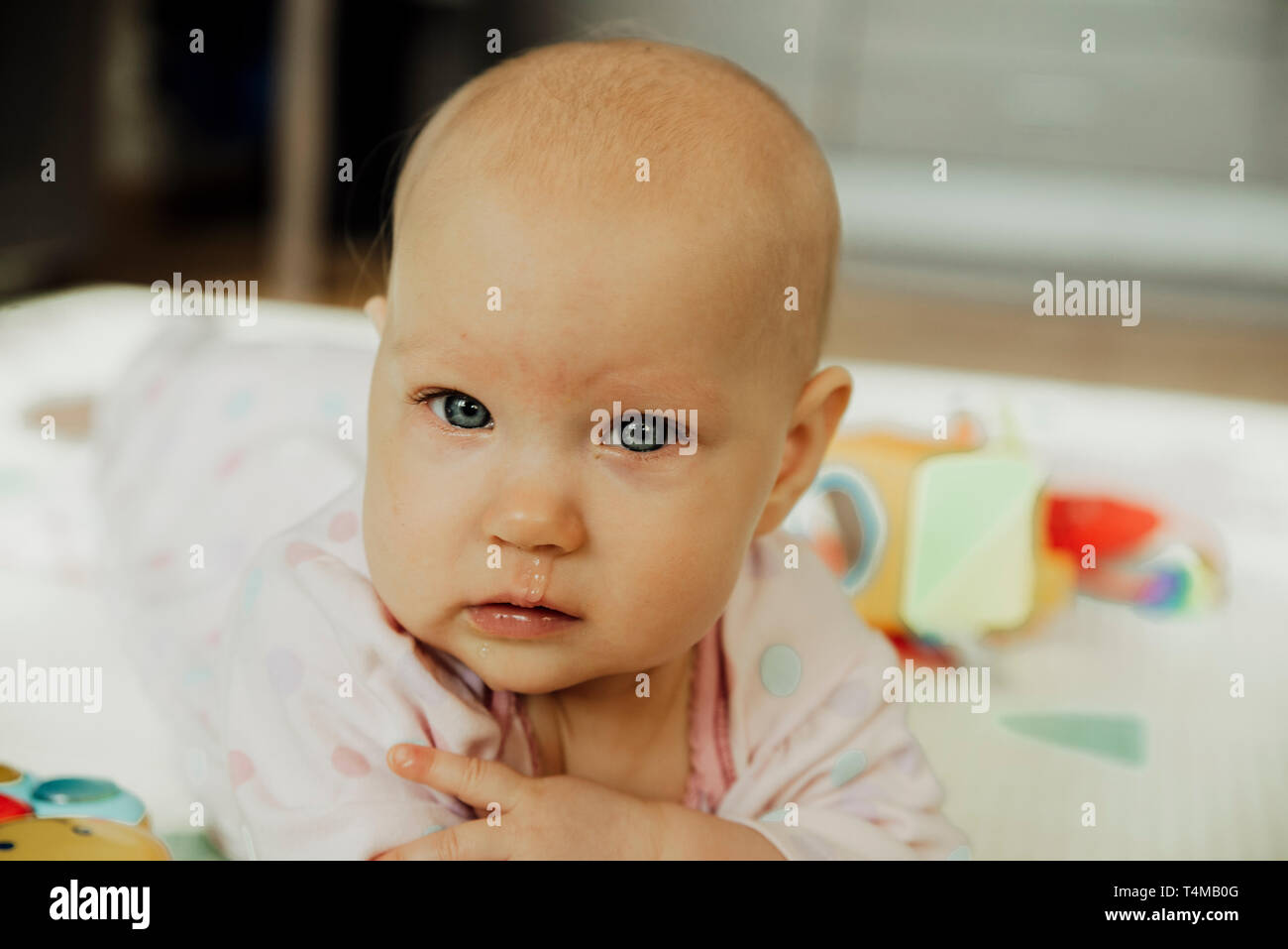 the first cold in a young child, crying, glass eyes, illness Stock ...