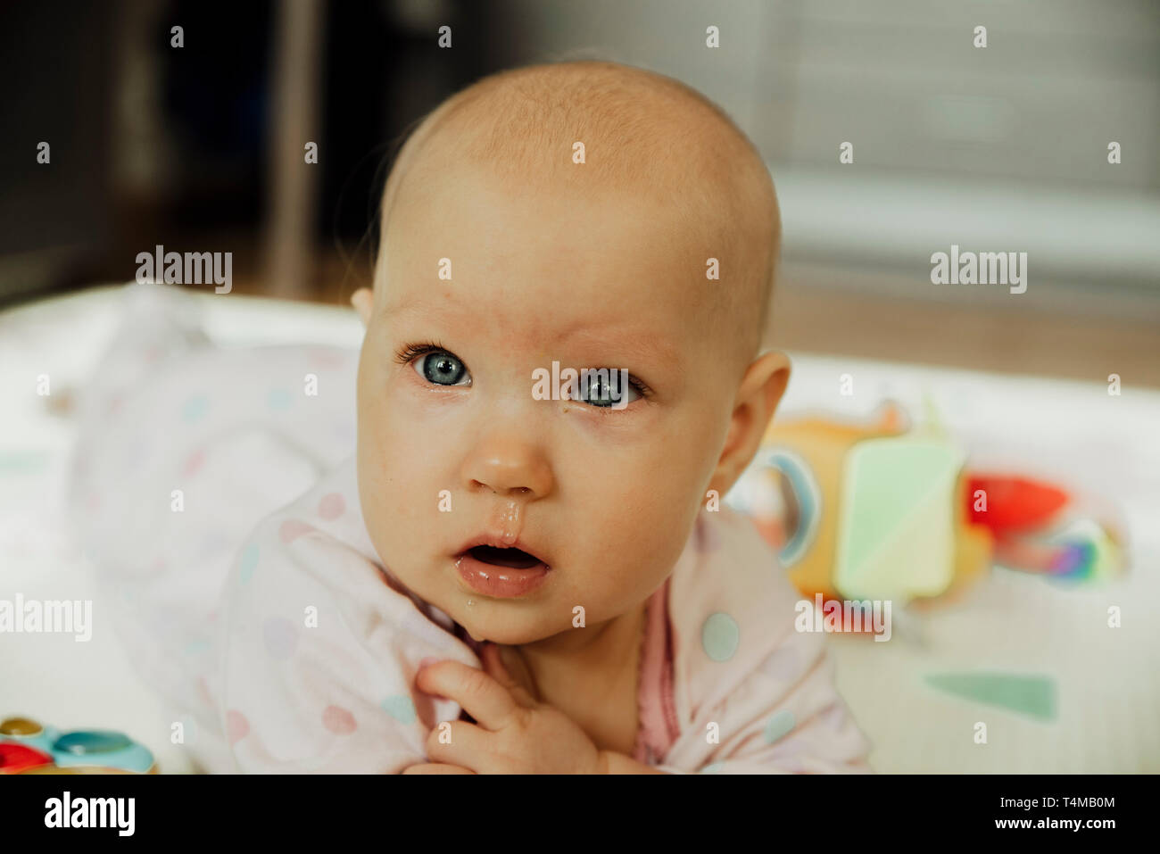 the first cold in a young child, crying, glass eyes, illness Stock ...