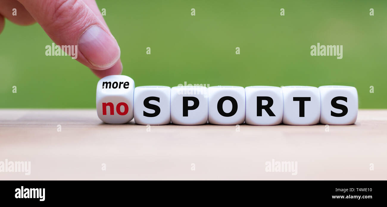 Hand turns a dice and changes the expression "no sports" to "more ...