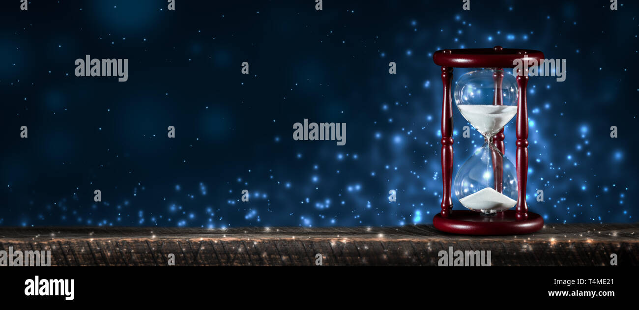 Hourglass blue background hi-res stock photography and images - Alamy