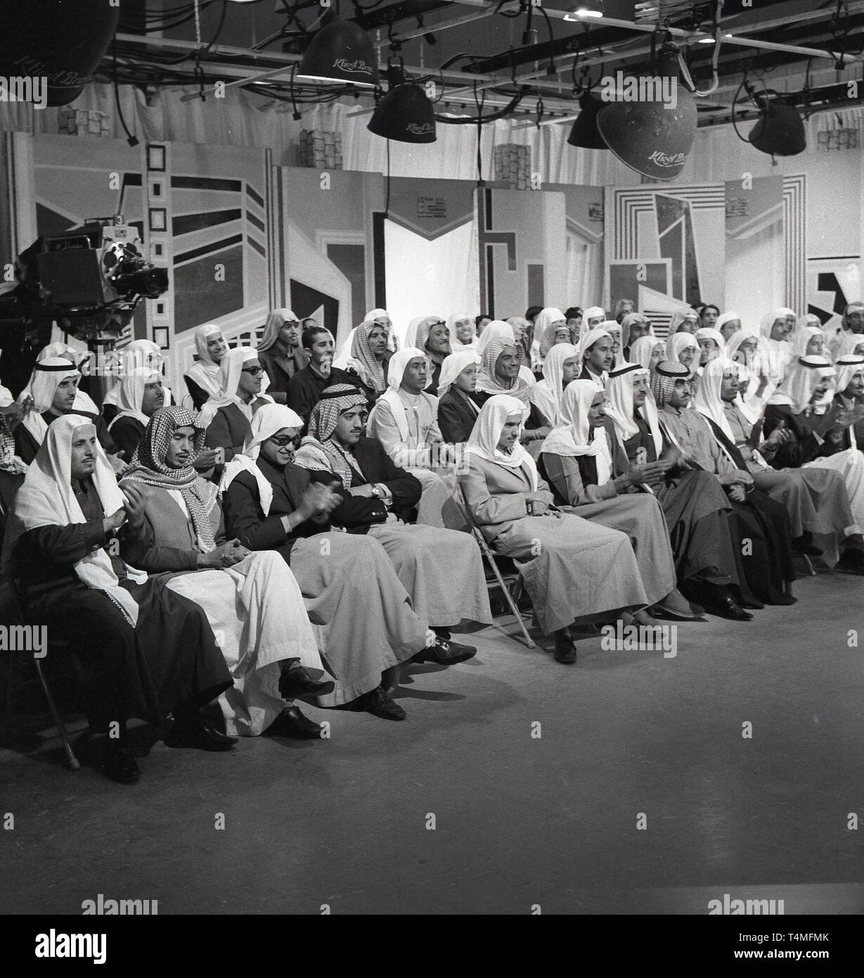 1960s, historical, television audience, saudi men in traditional arab ...