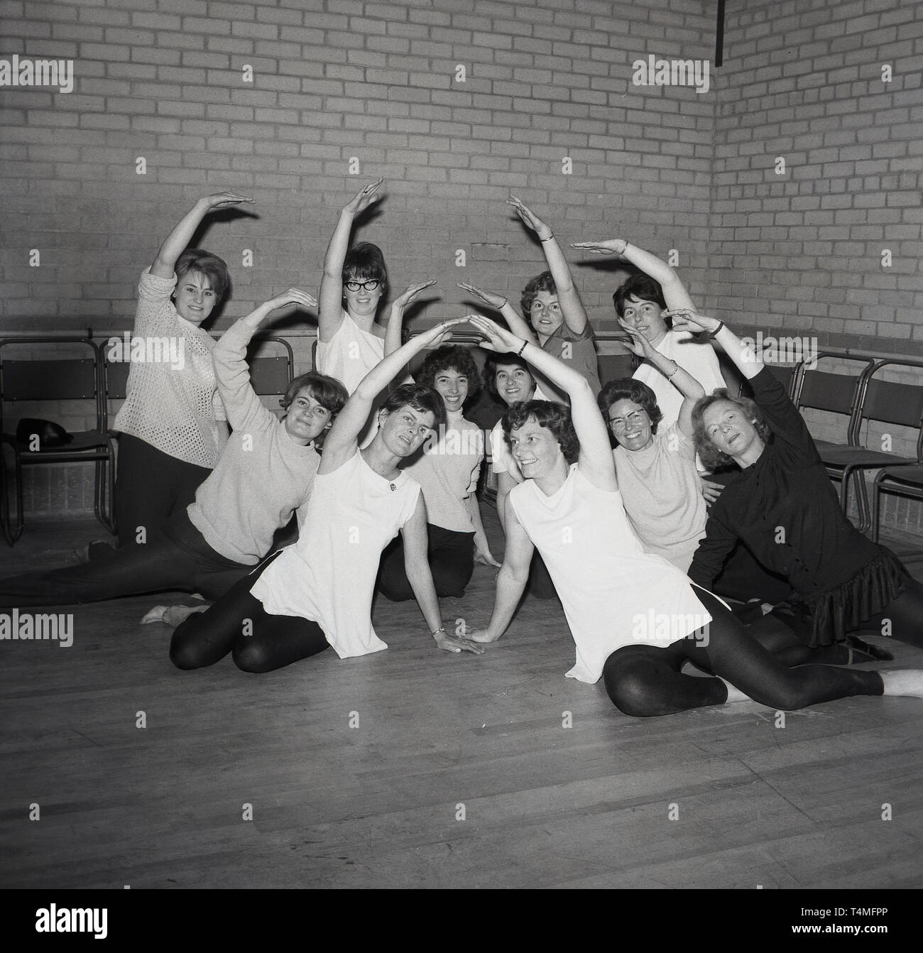 1960s, historical, ladies doing a yoga or keep fit class at the local ...