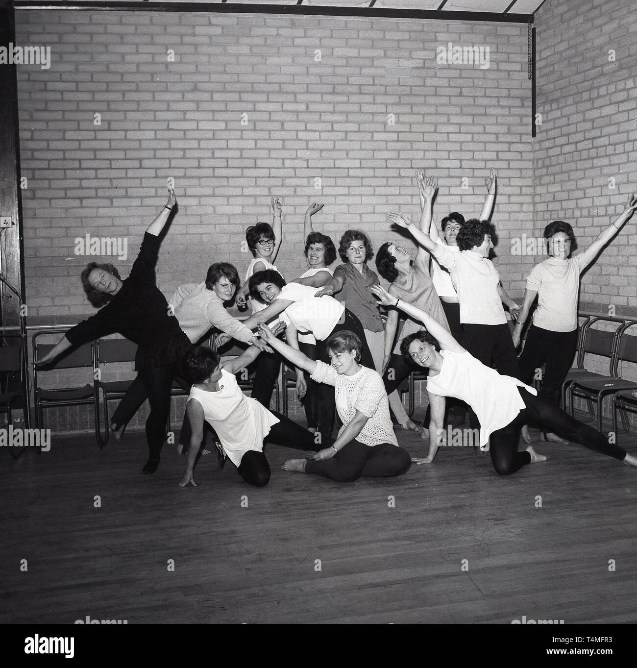 1960s, historical, ladies in leggings doing an activity or keep fit ...