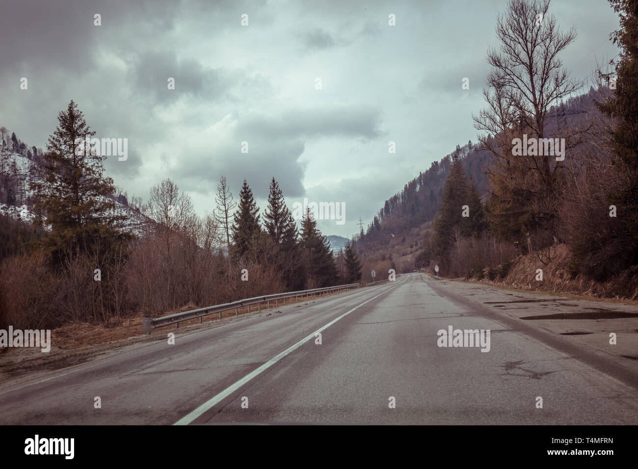 Mountain road, dramatic light Stock Photo - Alamy