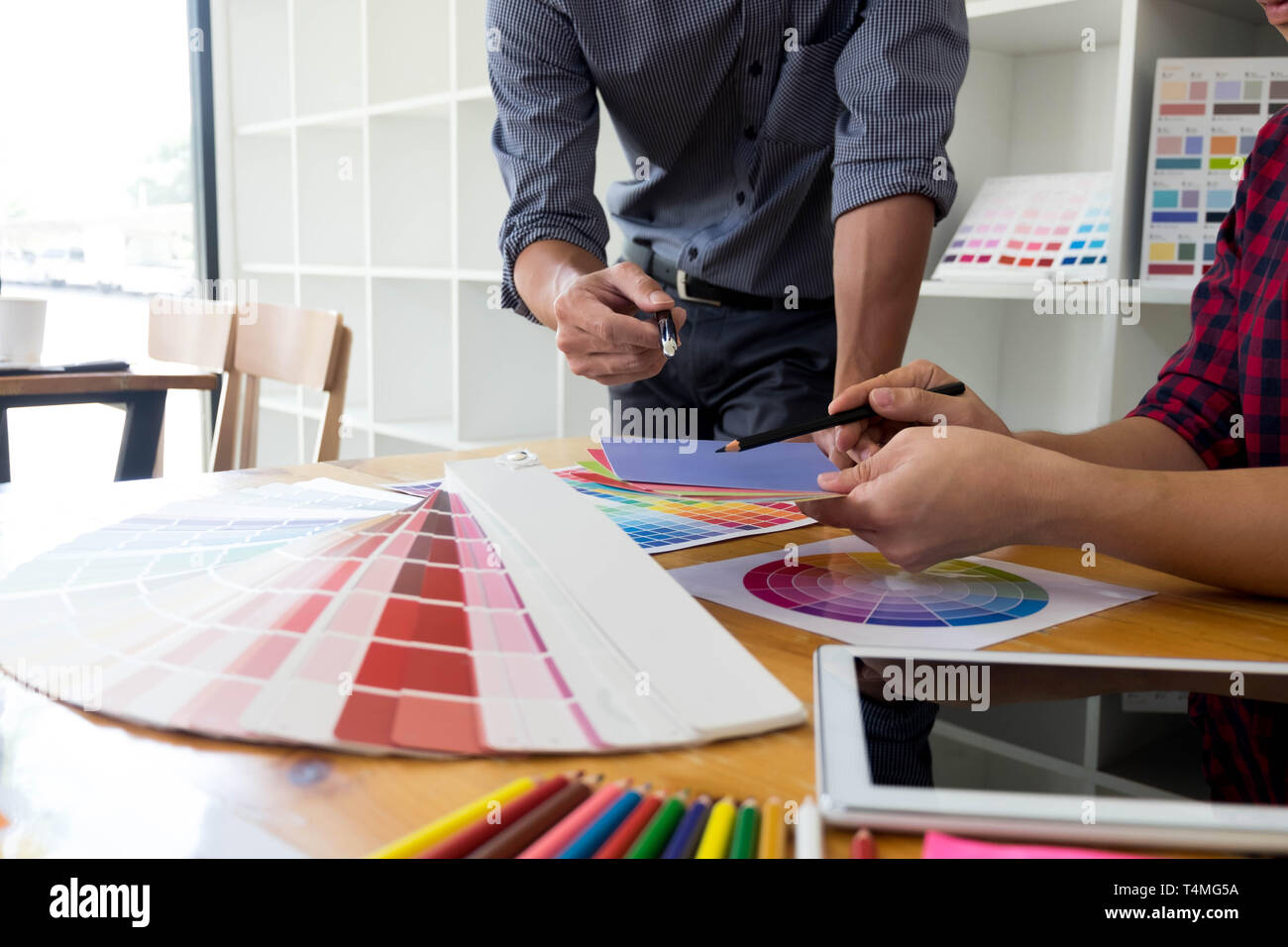 Graphic designers choose colors from the color bands samples for design ...