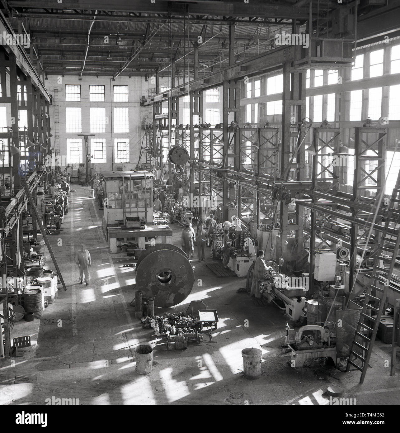1950s, historical, view inside a high ceiling factory building, England ...
