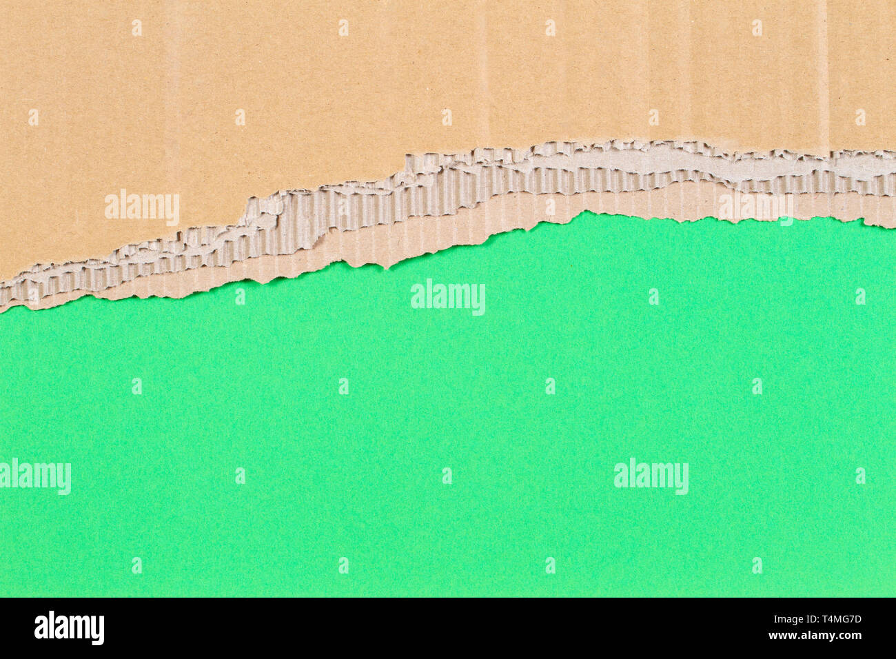 Brown corrugated cardboard ragged edge frame on green background Stock ...