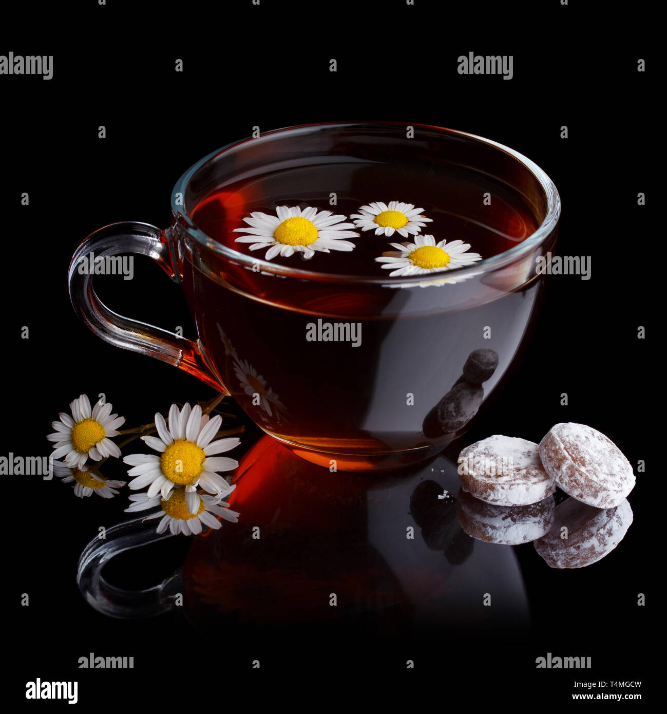 Herbal tea with sweet candys Stock Photo - Alamy