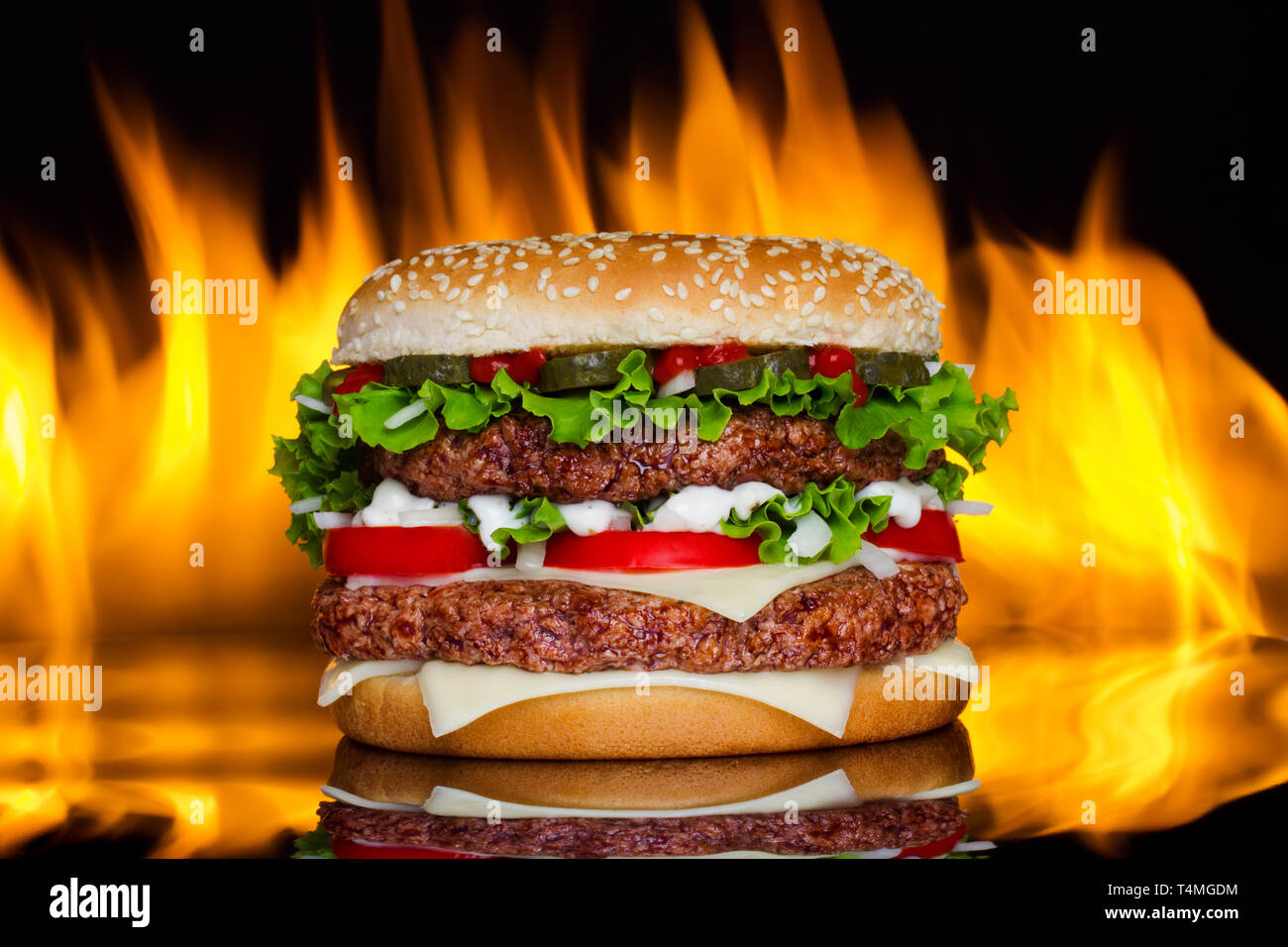 Hamburger fire flame cheeseburger hi-res stock photography and images ...