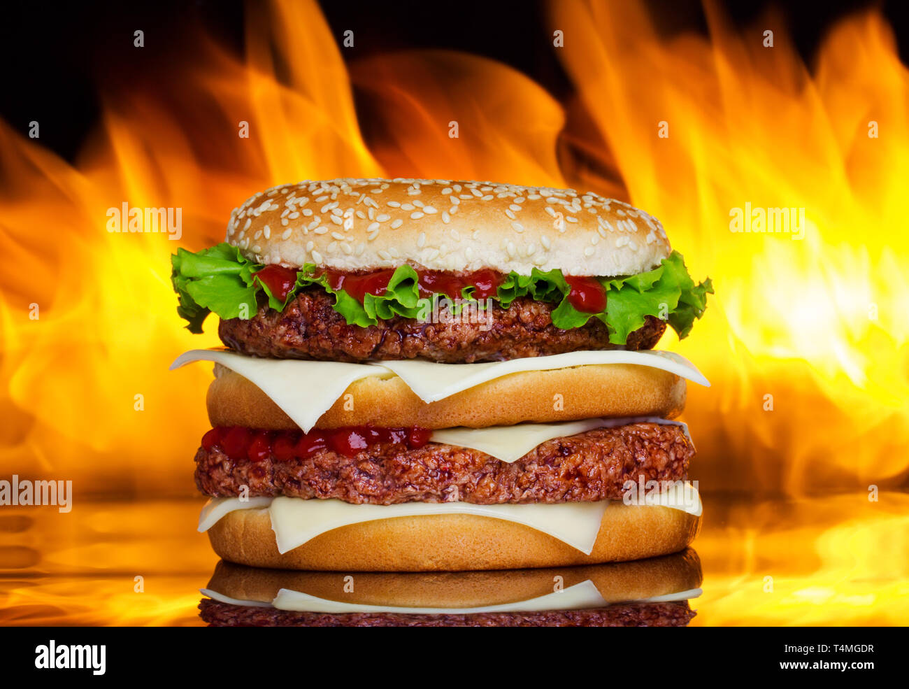 Hamburger with fire Stock Photo - Alamy