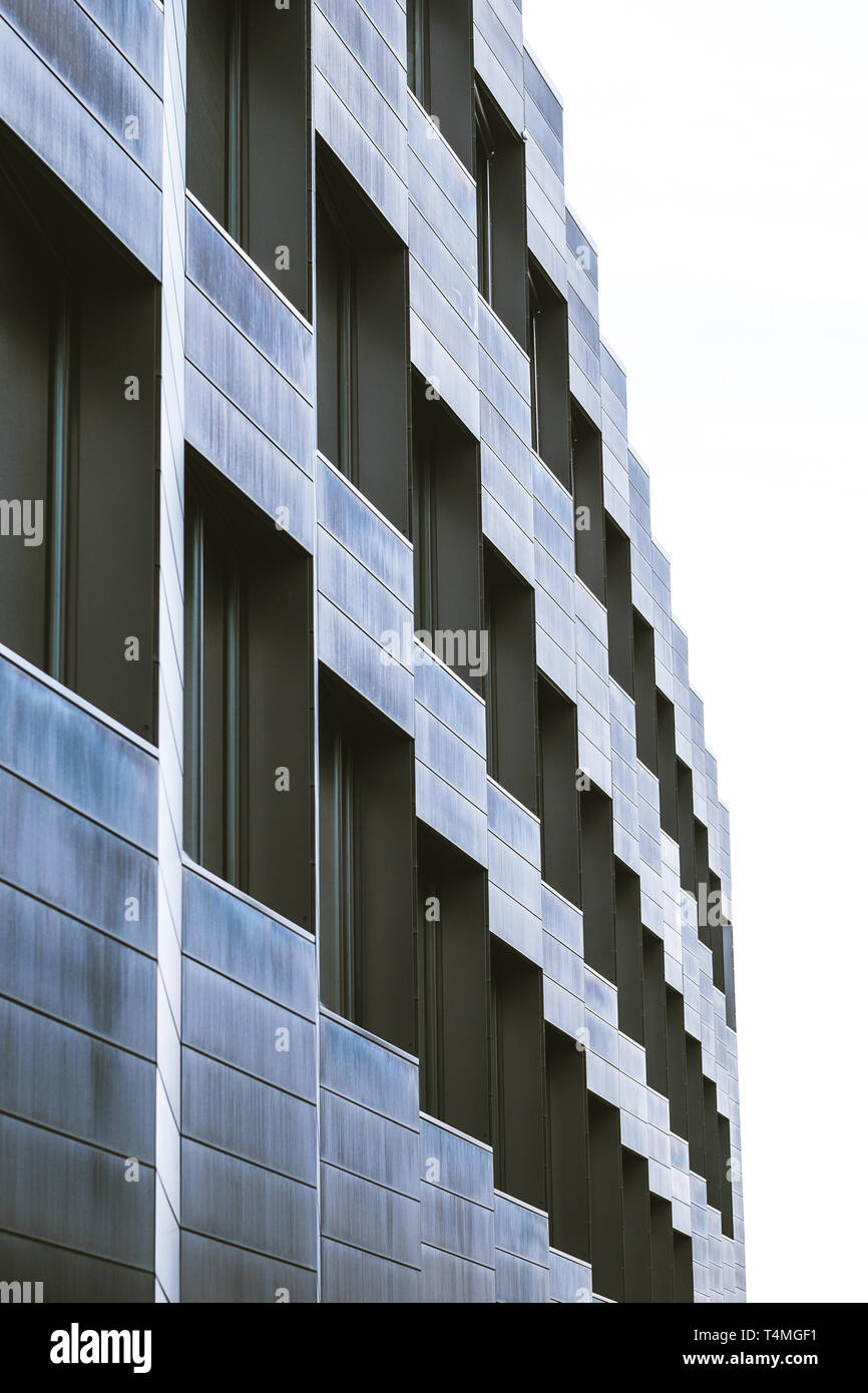 Closeup of modern building facade with repeatable rectangles in grey ...