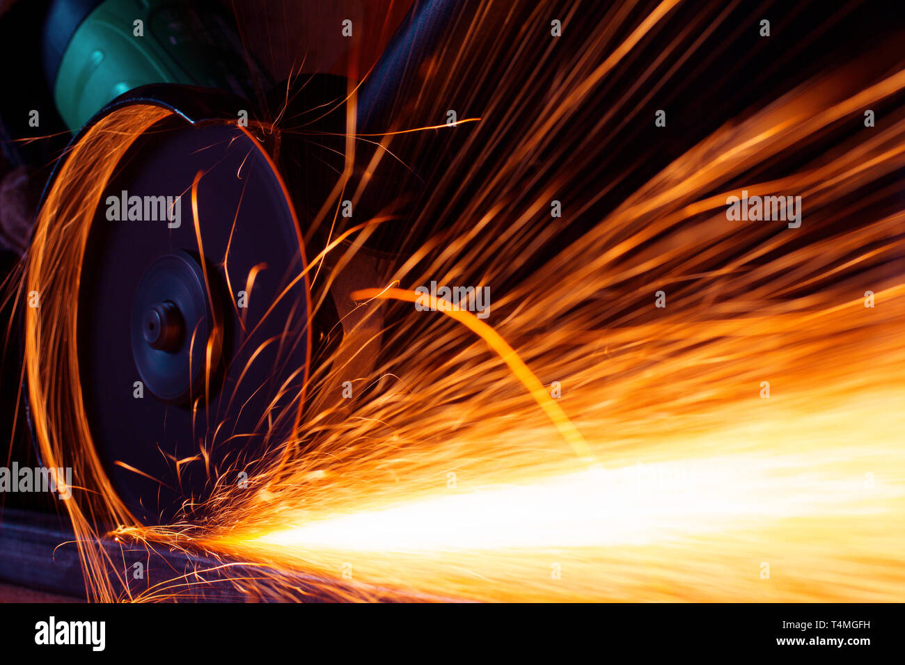 Sparks while grinding iron Stock Photo - Alamy
