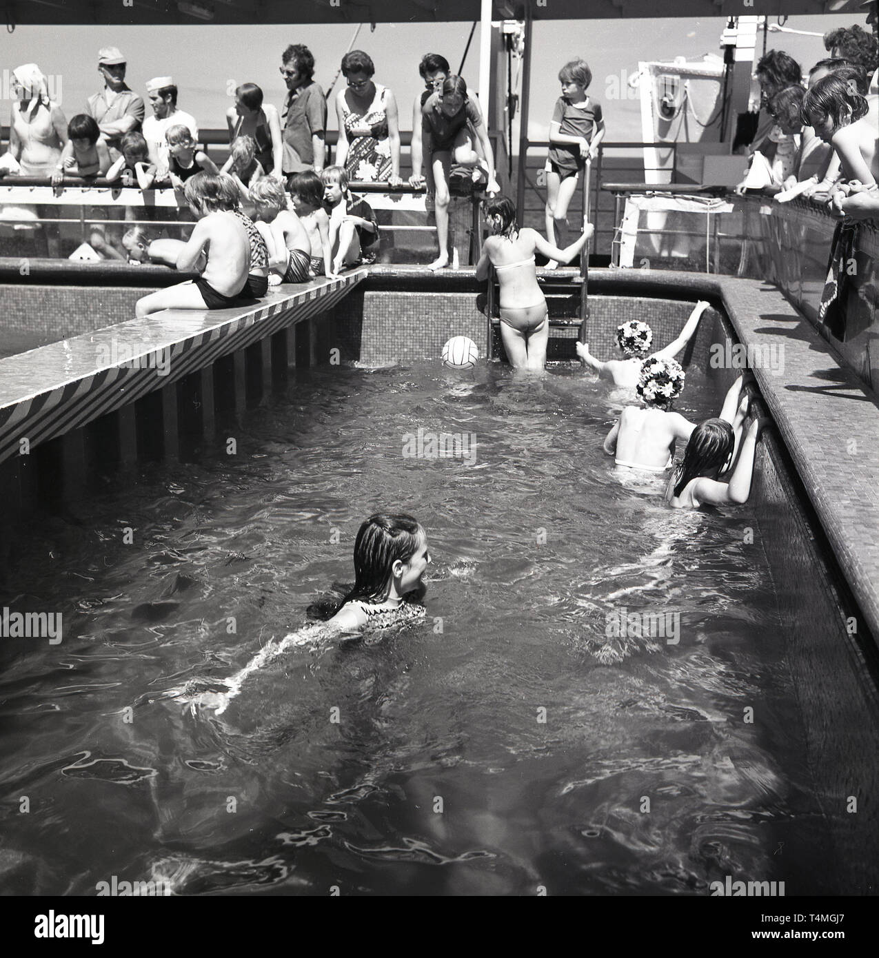 1960s, youngsters playing in the childrens section of the ship's open ...