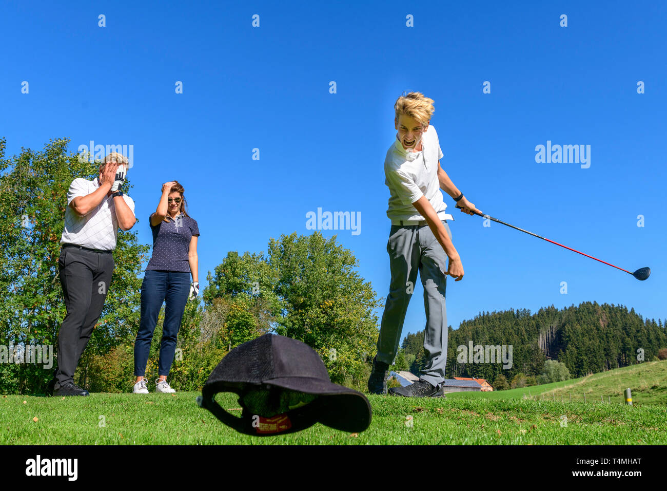 Emotional young golf player gets angry after bad drive Stock Photo - Alamy