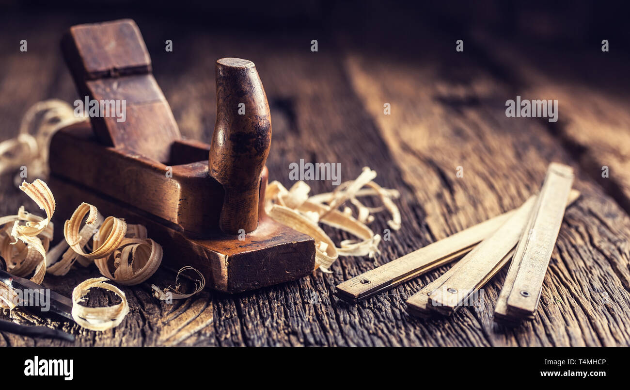 Old planer and other vintage carpenter tools in a carpentry workshop ...
