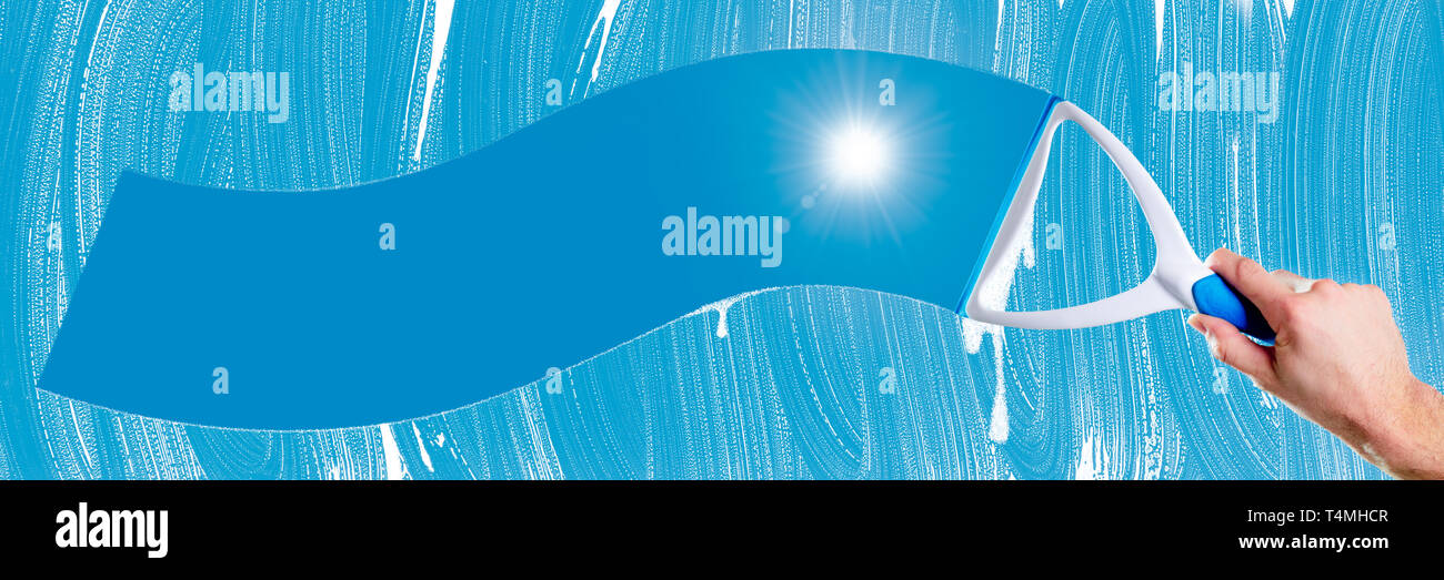 Hand With Squeegee Cleaning Soapy Window With Blue Sky And Sun Shining ...