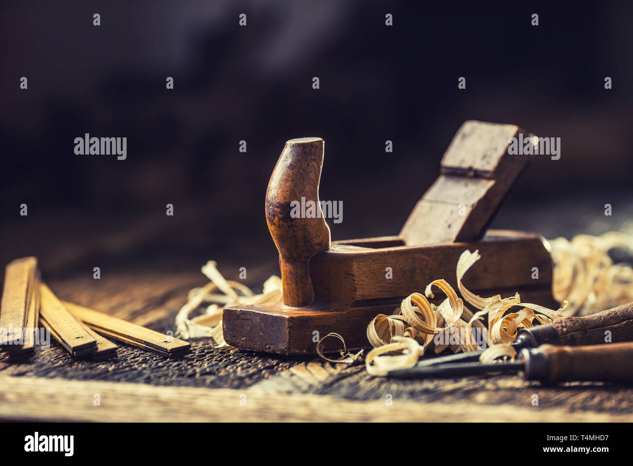 Old planer and other vintage carpenter tools in a carpentry workshop ...