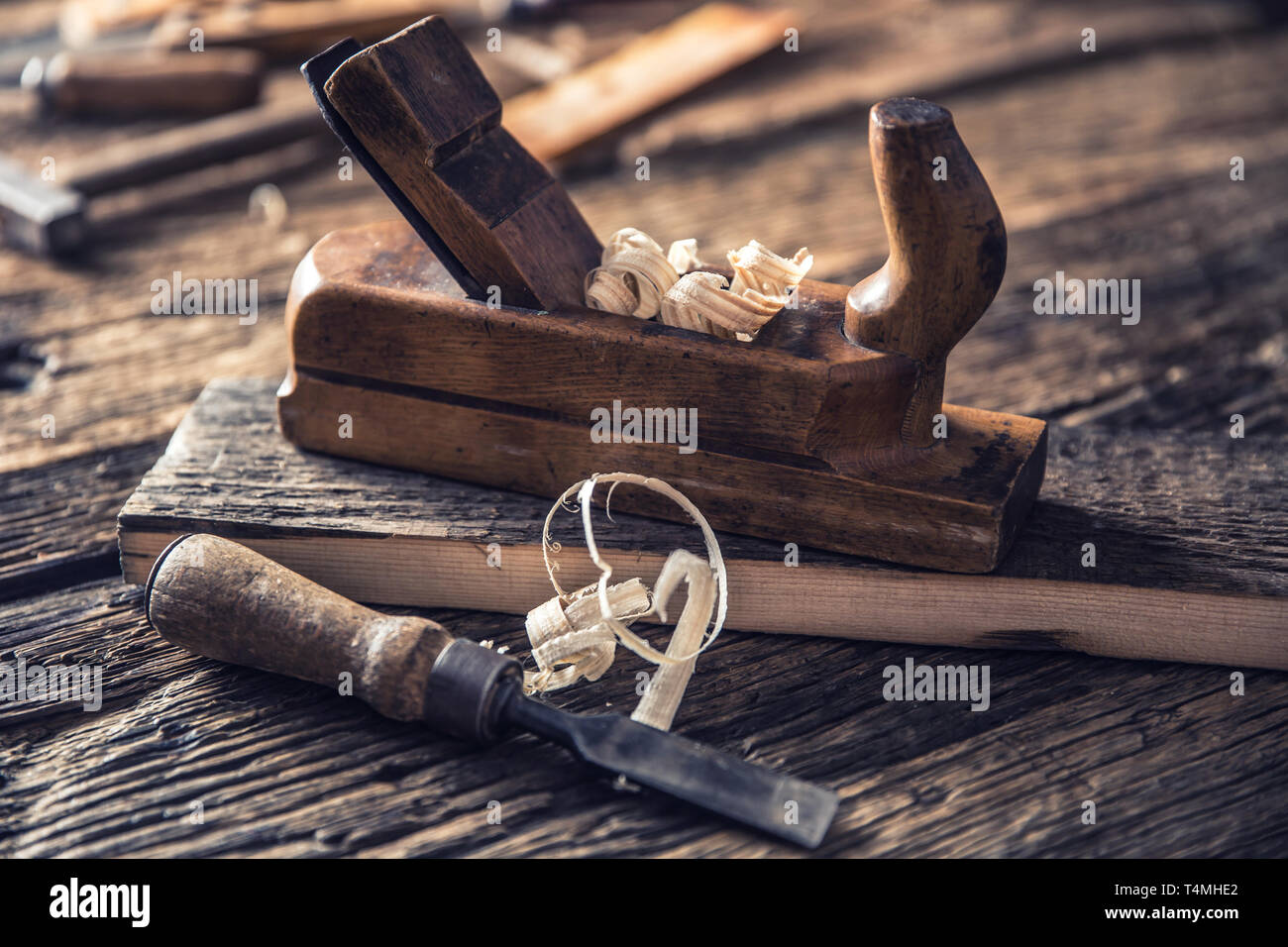Old planer and other vintage carpenter tools in a carpentry workshop ...