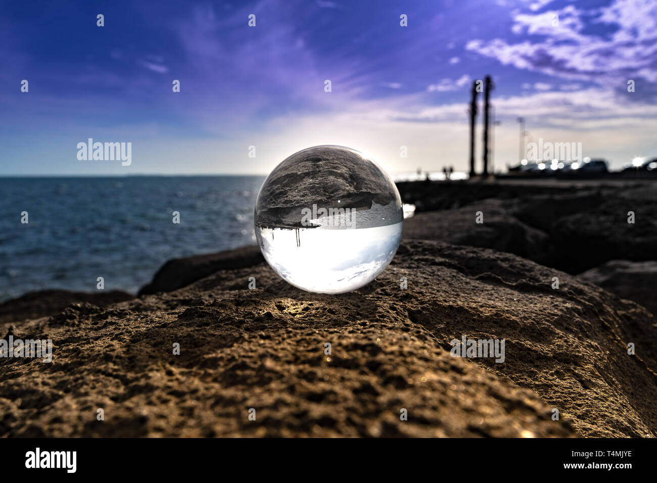 Crystal ball with ocean and sky background Stock Photo - Alamy