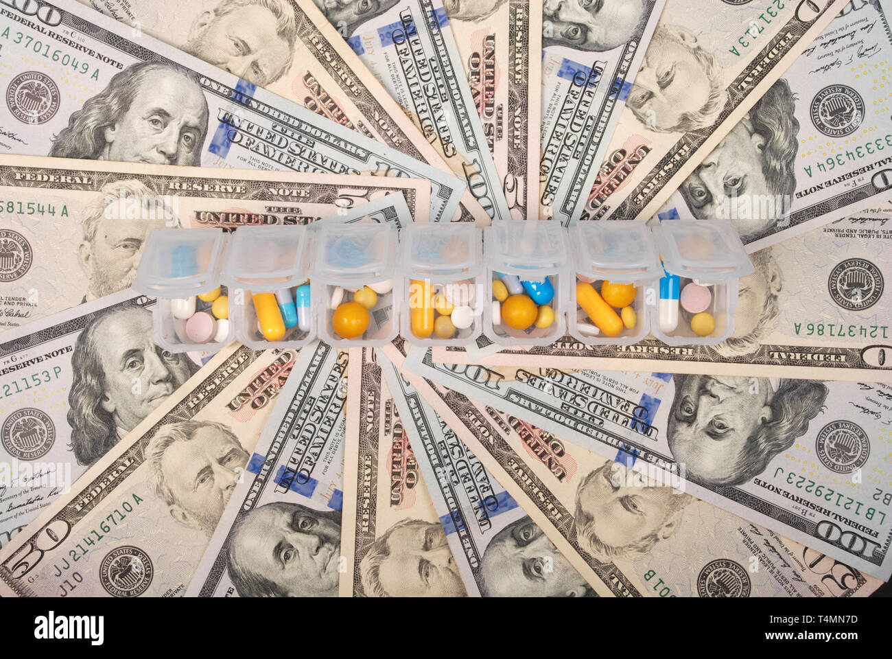 Pill box on mandala kaleidoscope from money. Abstract money background ...