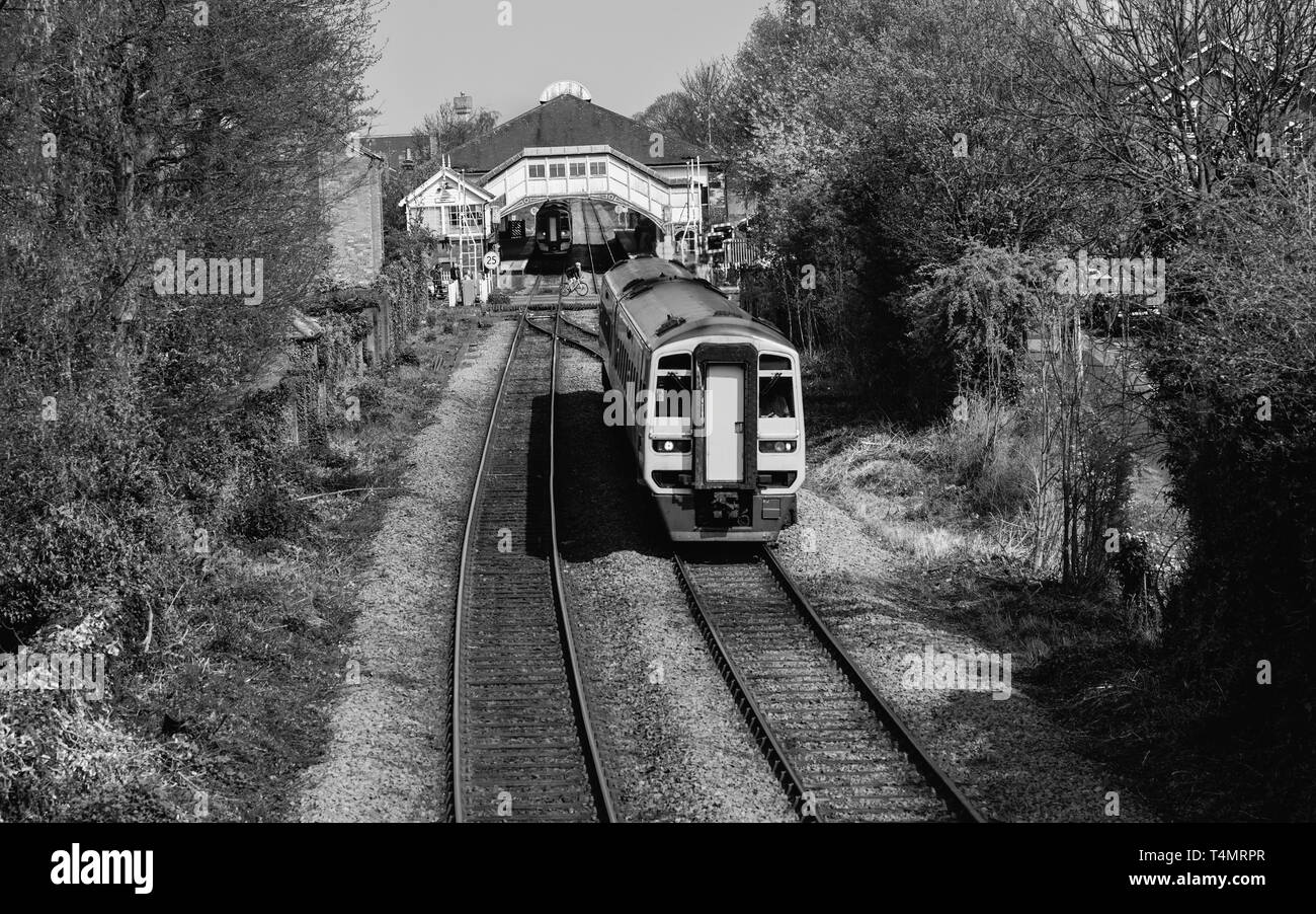 Railway trains arrive and depart mainline railway station on a fine ...