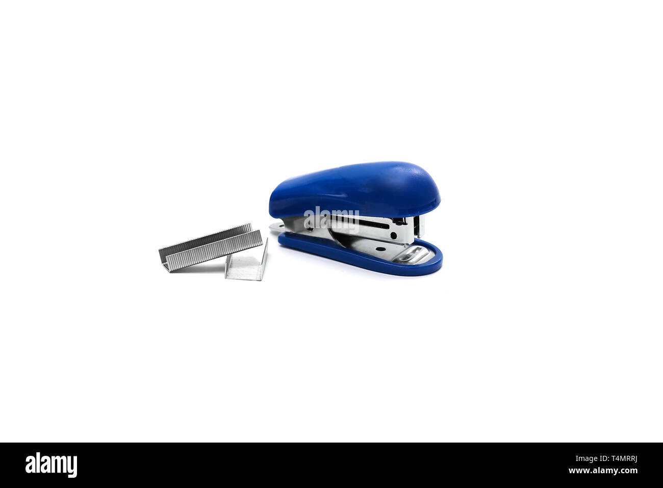Blue office stapler with metal brackets are isolated on white ...