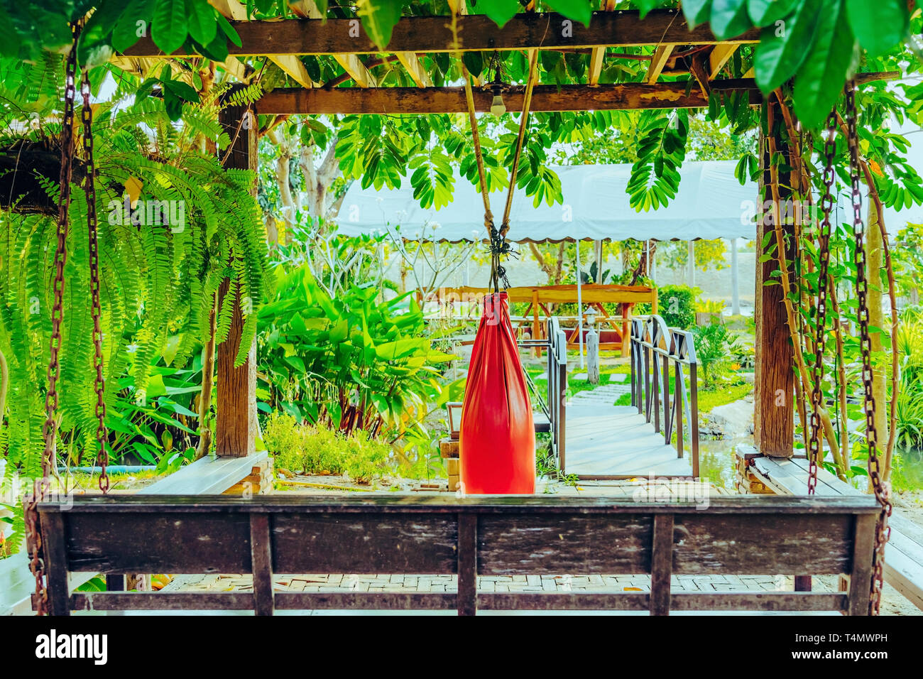 Red sand bag for Muay Thai hanging in the garden living room Stock ...