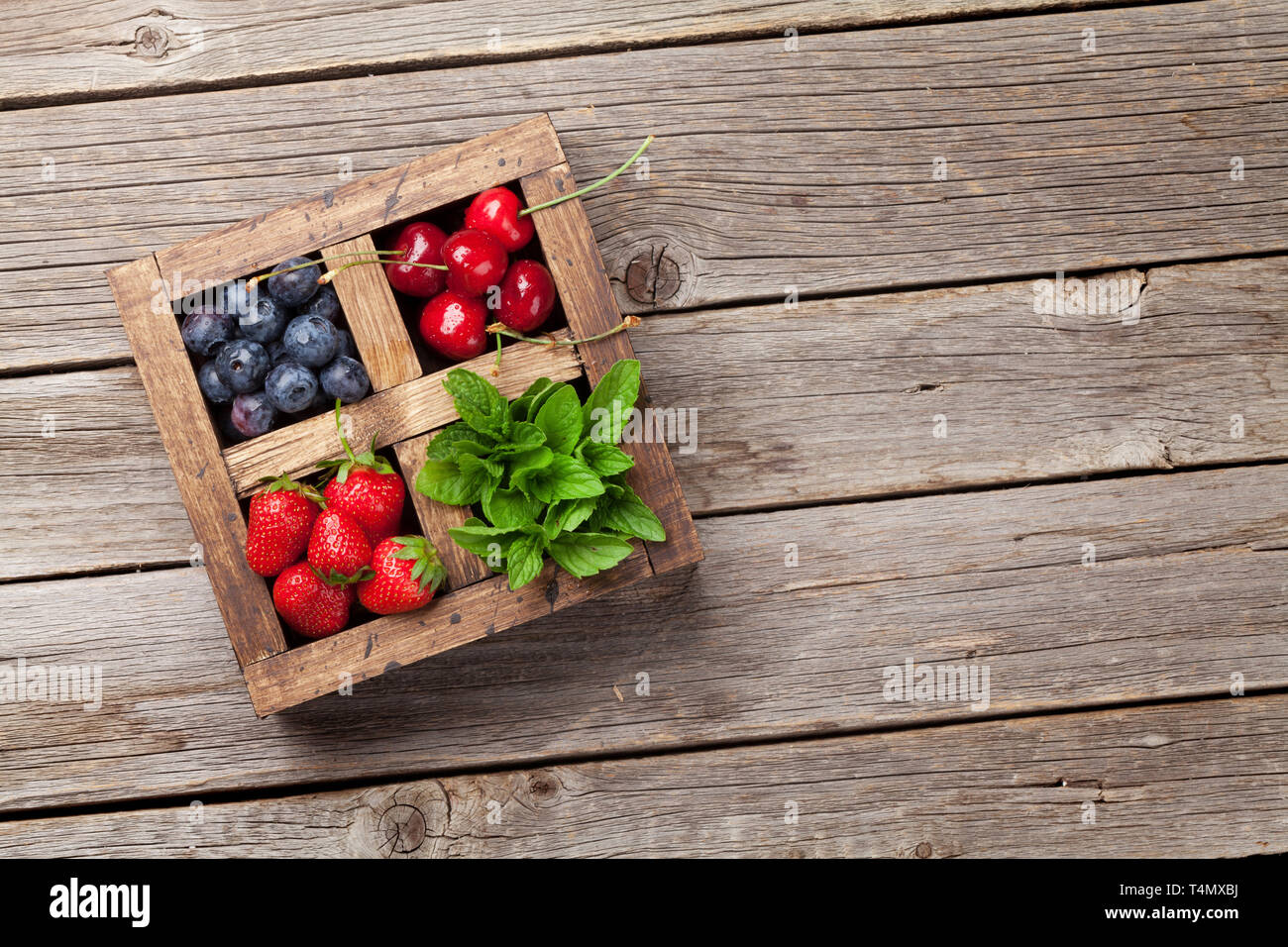 Fresh summer berries box. Cherry, blueberry, strawberry and mint. Top ...