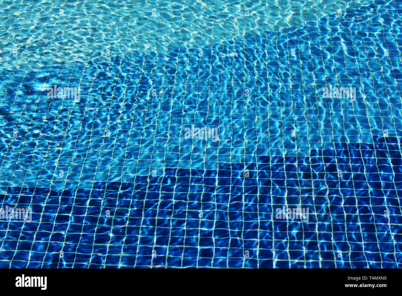Swimming pool mosaic bottom caustics ripple like sea water. Flow with ...