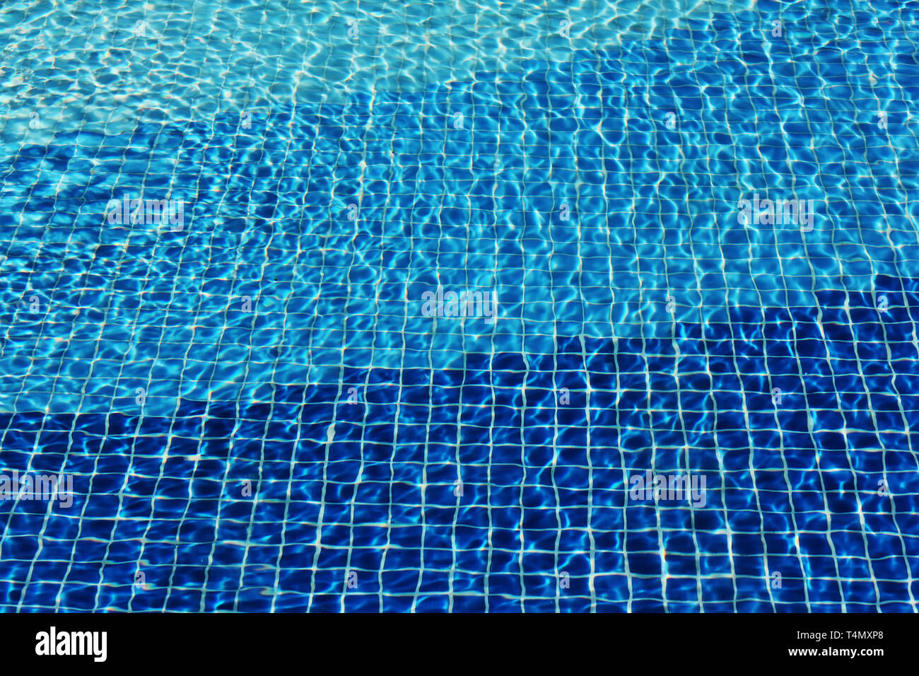 Swimming pool mosaic bottom caustics ripple like sea water. Flow with ...