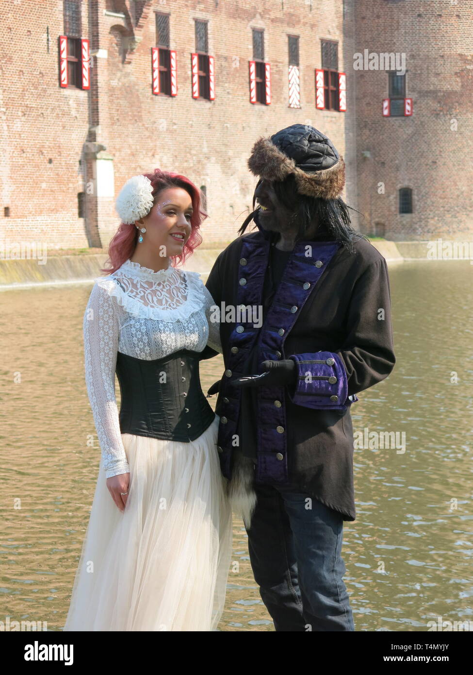 Young couple in costumes that resemble "Beauty and the Beast" at the ...