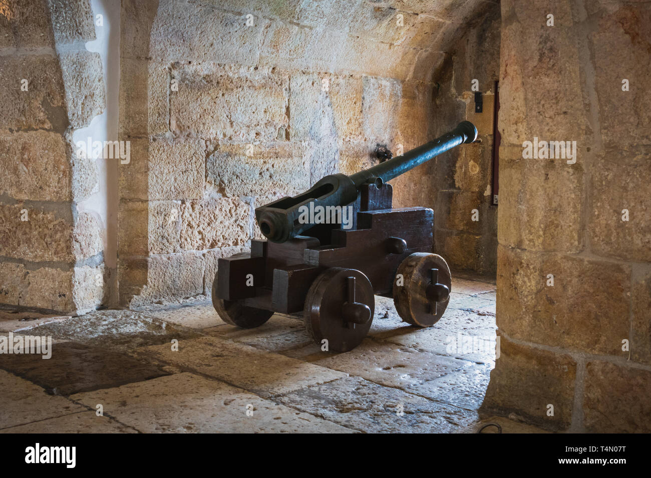 Historical cannon in a defense tower pointing out of a windows Stock ...