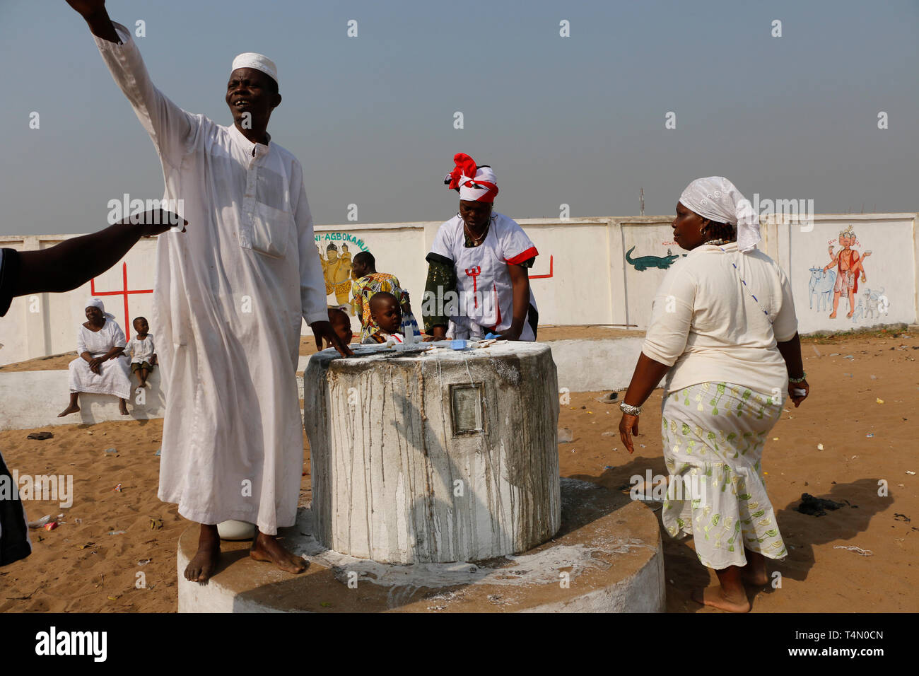 Voodoo people dressed in white clothes in Cotonou, Benin Stock Photo ...