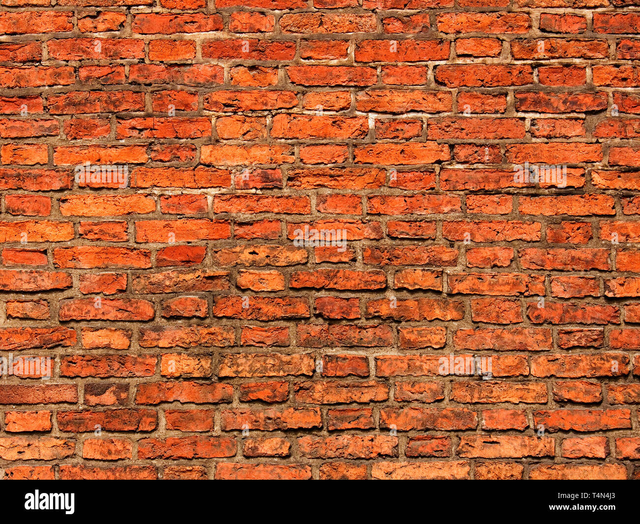 Brick wall - vibrant red rustic background Stock Photo - Alamy