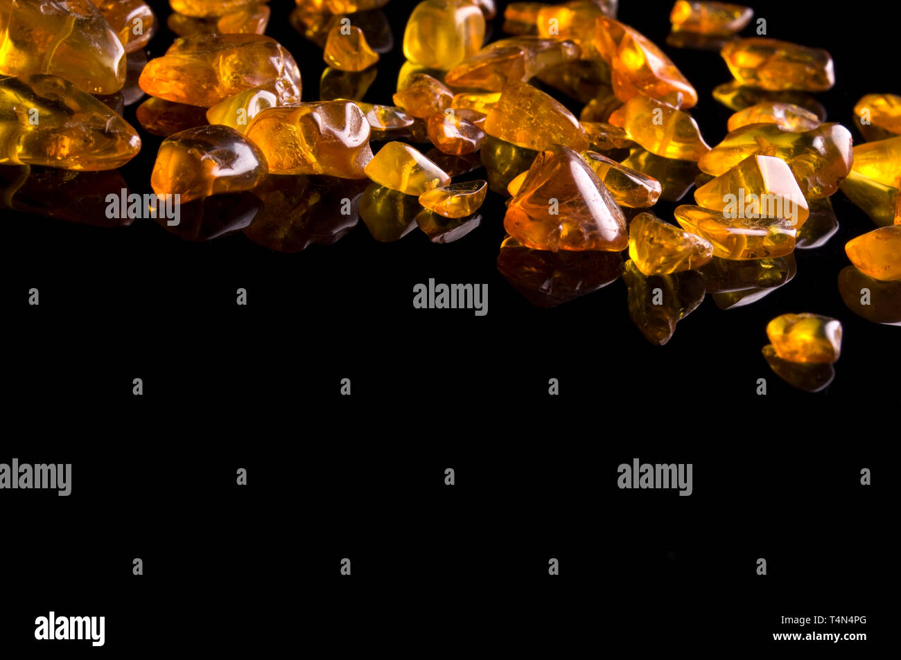 Amber on black background with copy space Stock Photo - Alamy