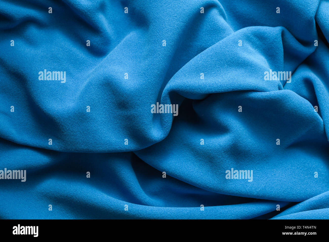 Texture of bright blue fleece, soft napped insulating fabric made of ...