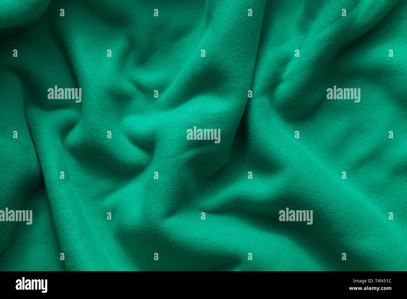 Texture of green fleece, soft napped insulating fabric made of ...