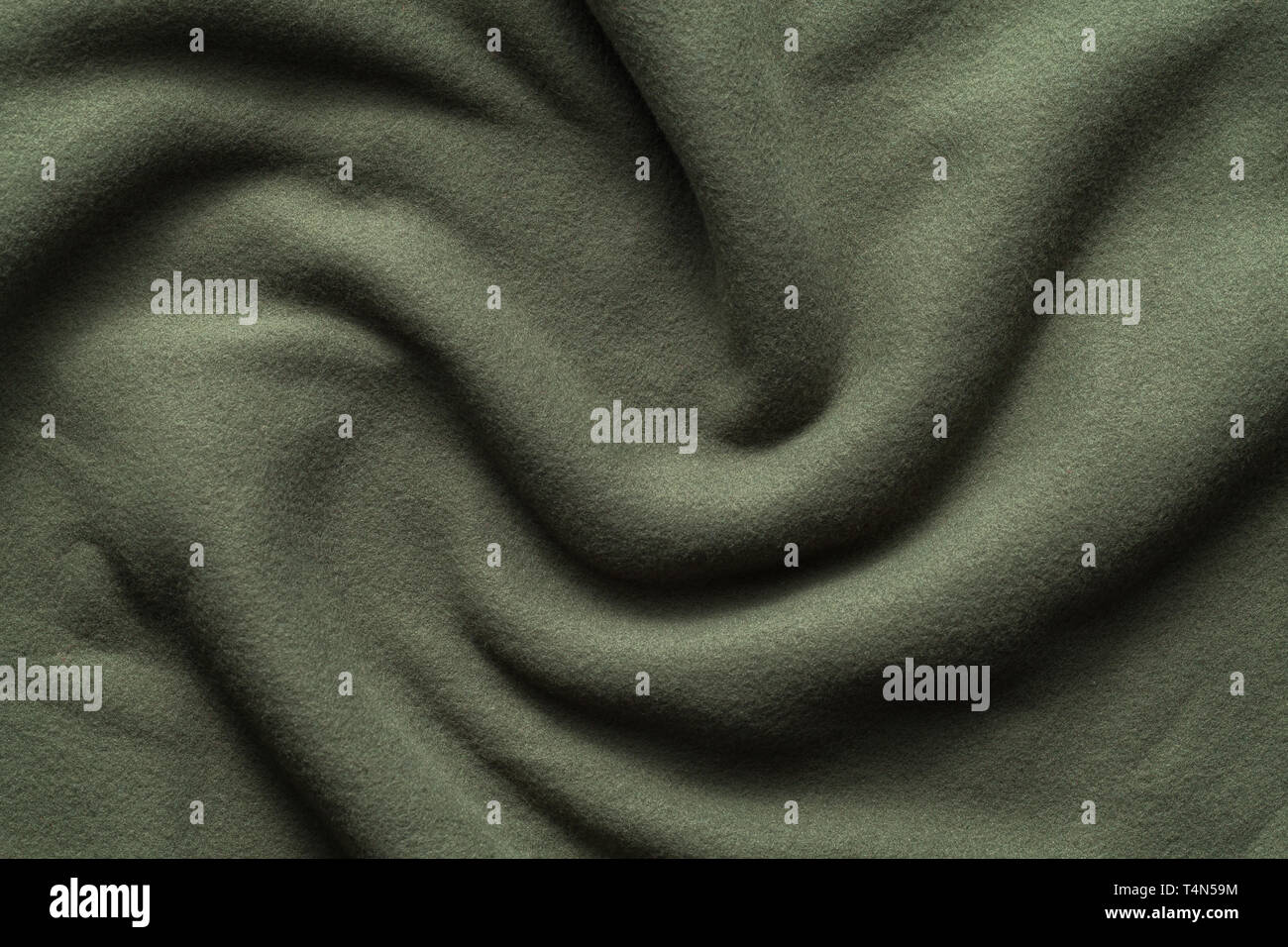 Texture of dark green fleece, soft napped insulating fabric made of ...